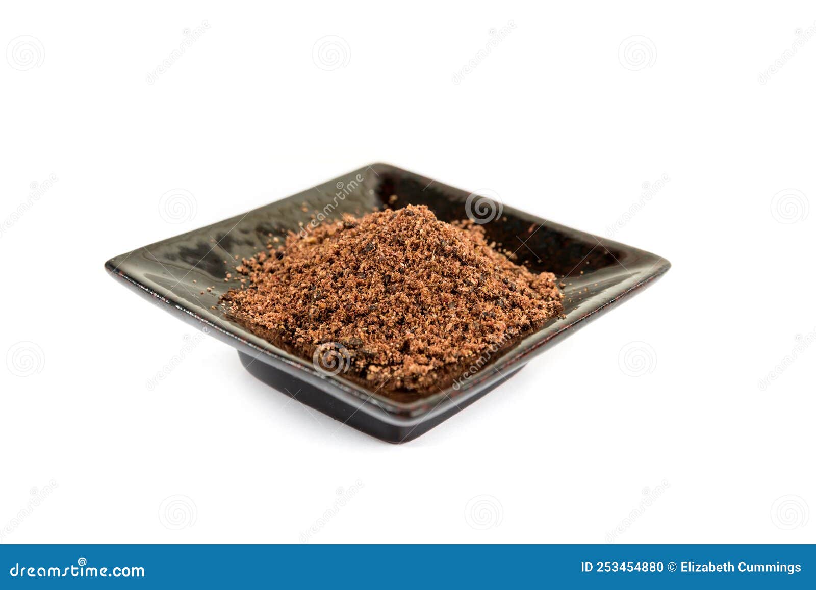 Ground Dried Sumac Berry Powder on a Black Ceramic Plate Stock Photo ...