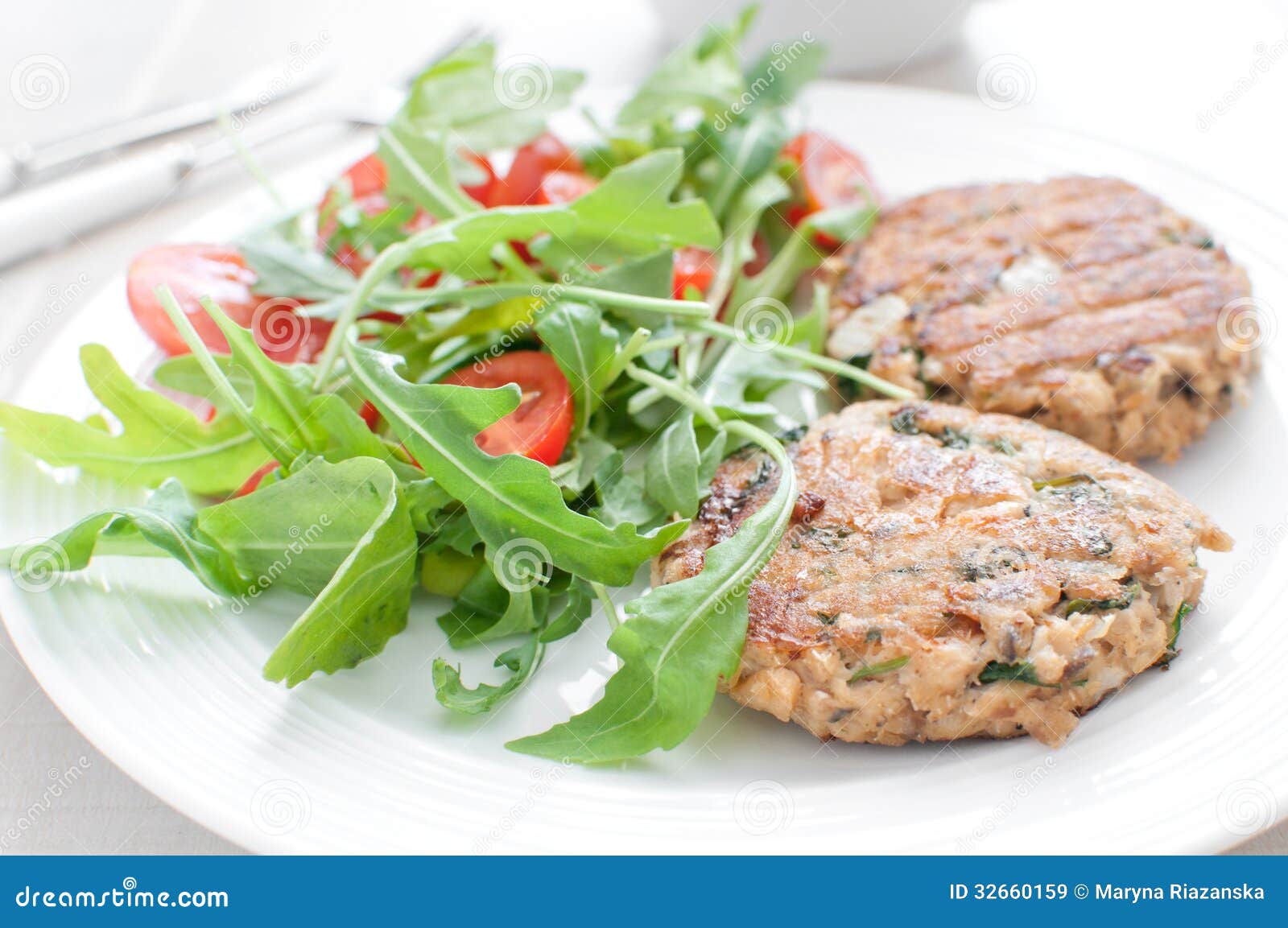 Ground Fish Patty with Arugula Tomato Salad Stock Image - Image of ...
