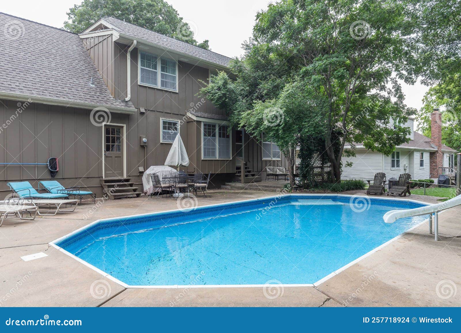 In-ground Swimming Pool with Slide in Lenexa, Kansas Editorial Stock ...