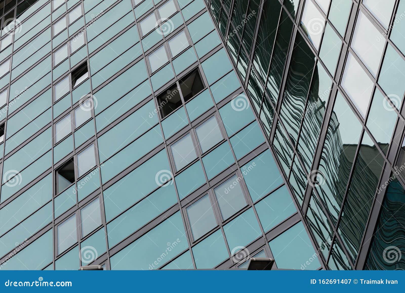 Ground View of Innovative Glass Building Facade with Some Open Windows ...