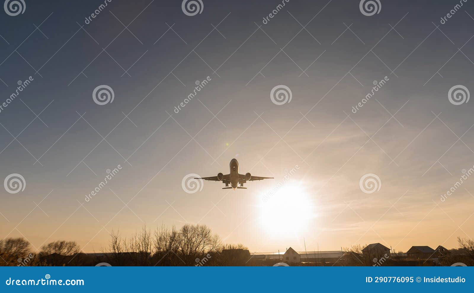 Ground View of a Landing Plane Against a Blue Sky. Stock Image - Image ...