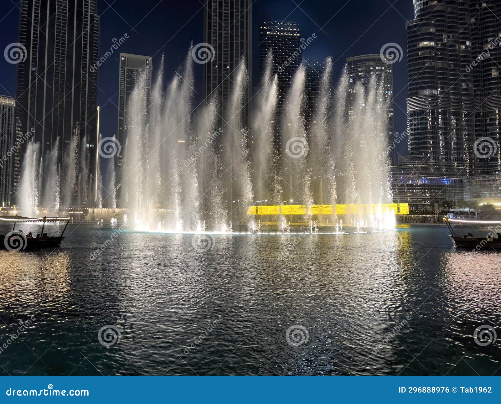 Ground View of Partial Downtown Dubai with Lighted Water Fountain at ...