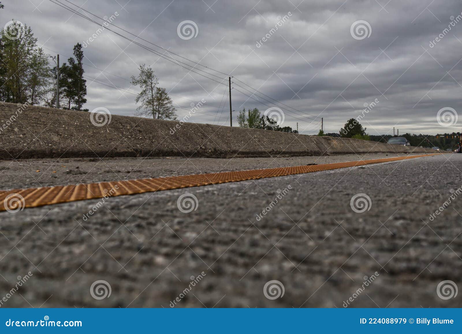 Ground View of a Road Center Divider and Oncoming Traffic Stock Image ...