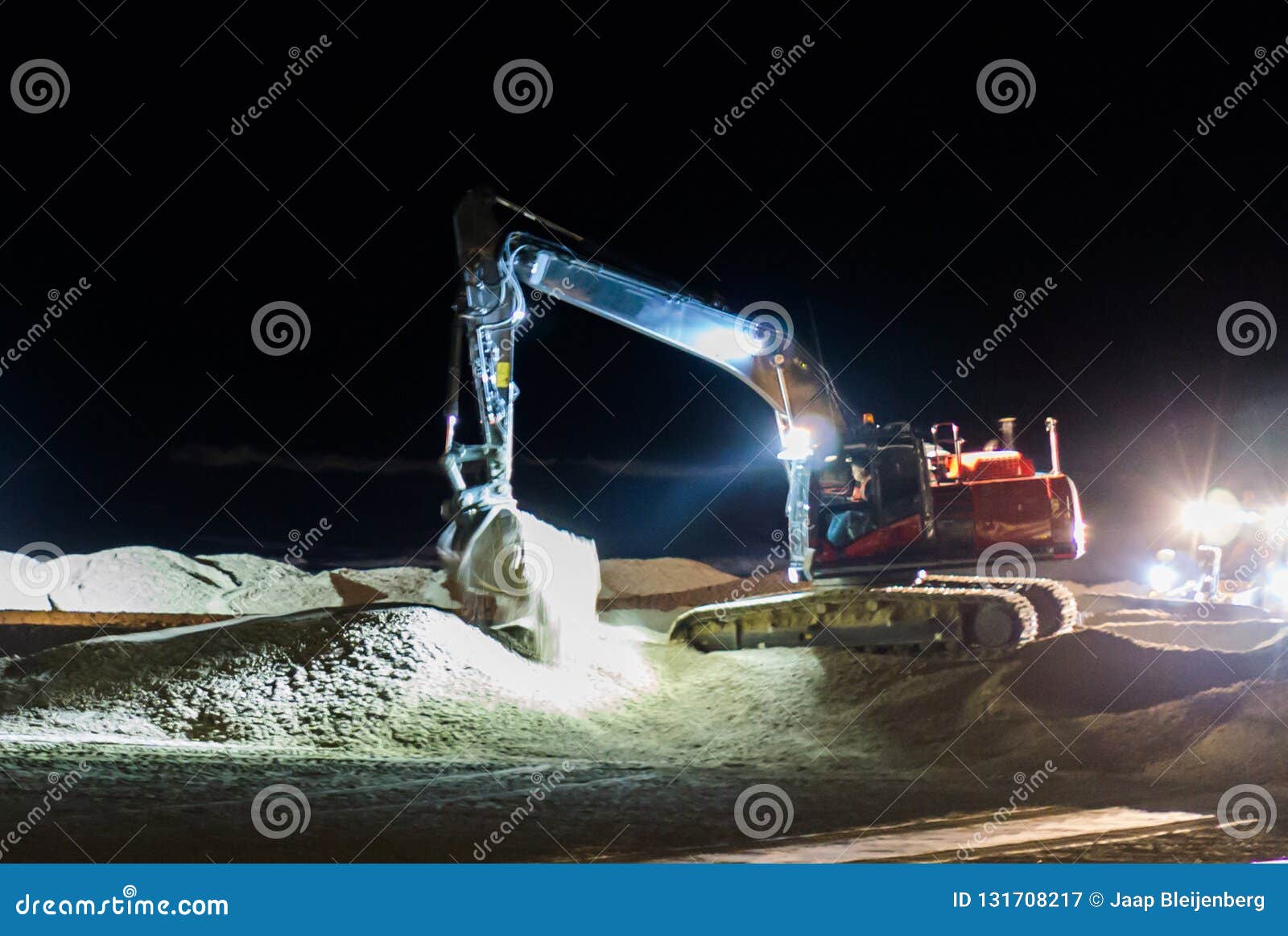 Ground Worker Working at Nighttime in the Dark with a Digger Machine ...