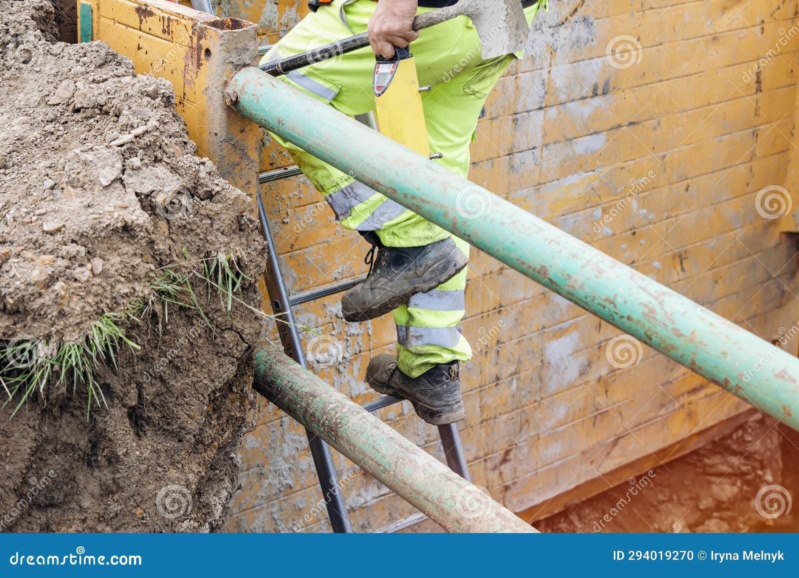 Groundworker Builder Using Steps Ladder To Get Out of Deep Drainage ...