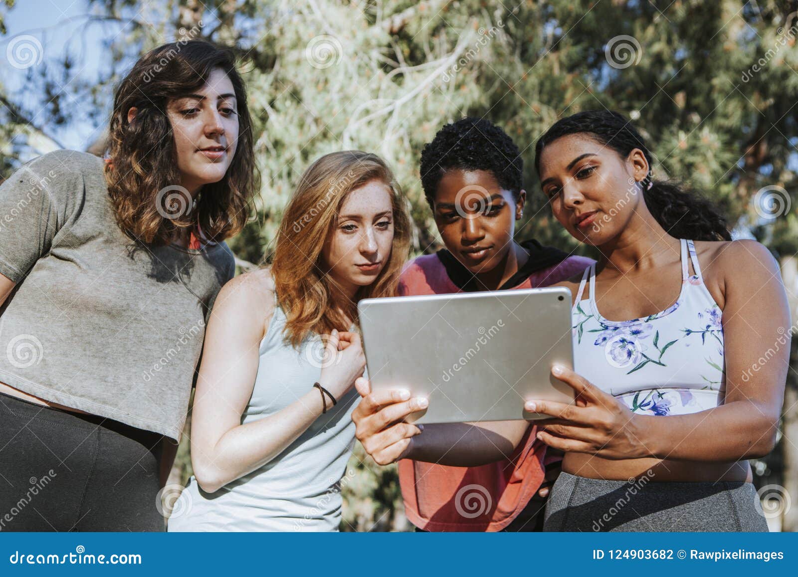 Group of Active Women Looking at a Digital Tablet Stock Photo - Image ...
