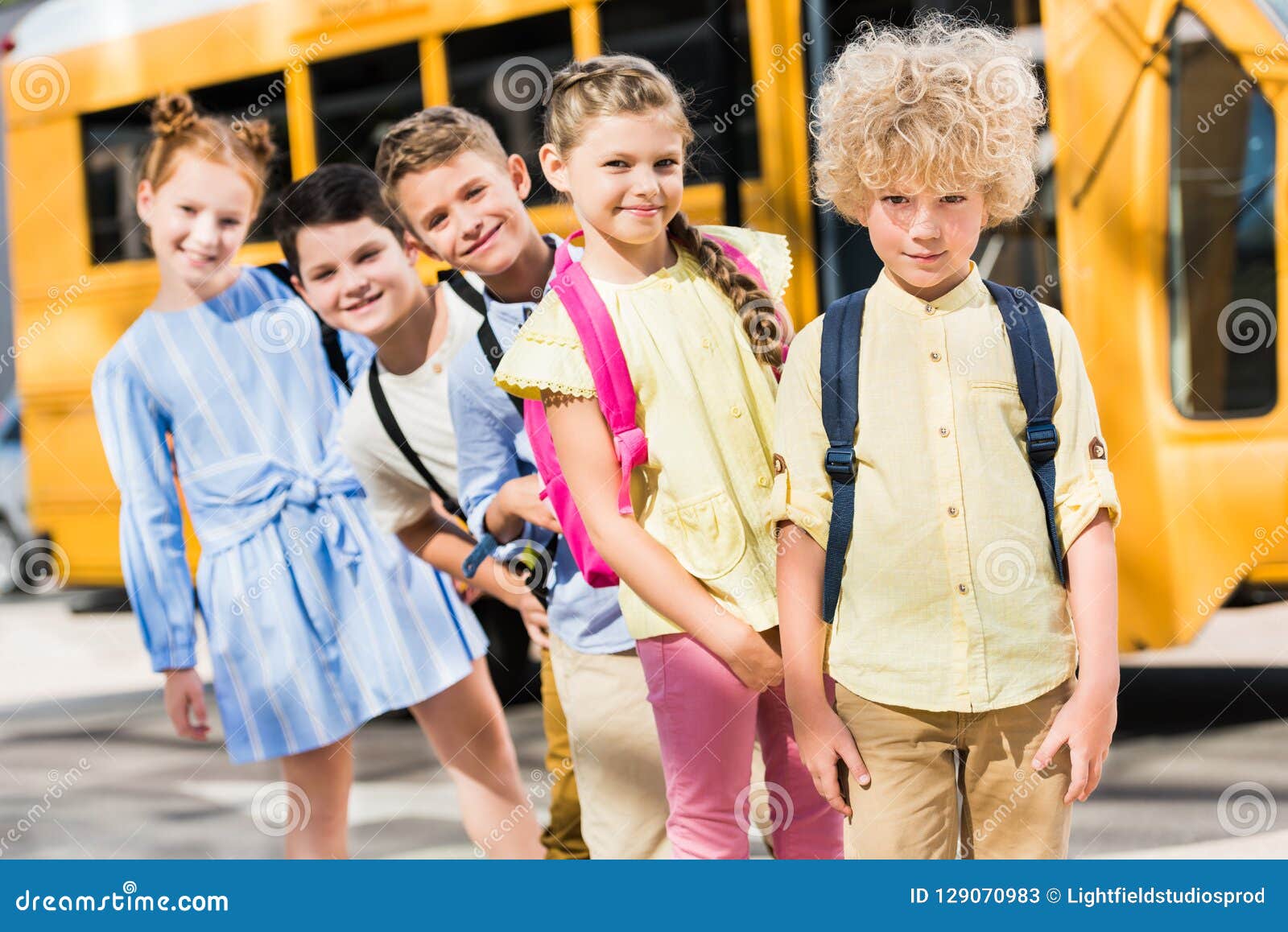 Group of Adorable Pupils Looking at Camera while Standing in Row in ...