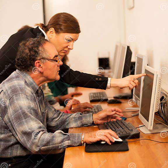 Group of Adults Learning Computer Skills. Intergenerational Tran Stock ...