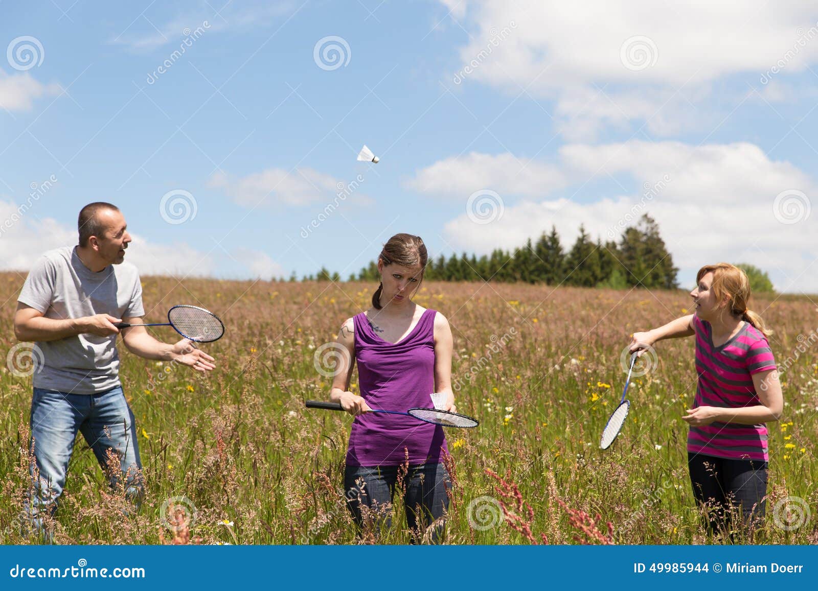 A Group Adults are Playing Badminton Stock Photo - Image of girl ...
