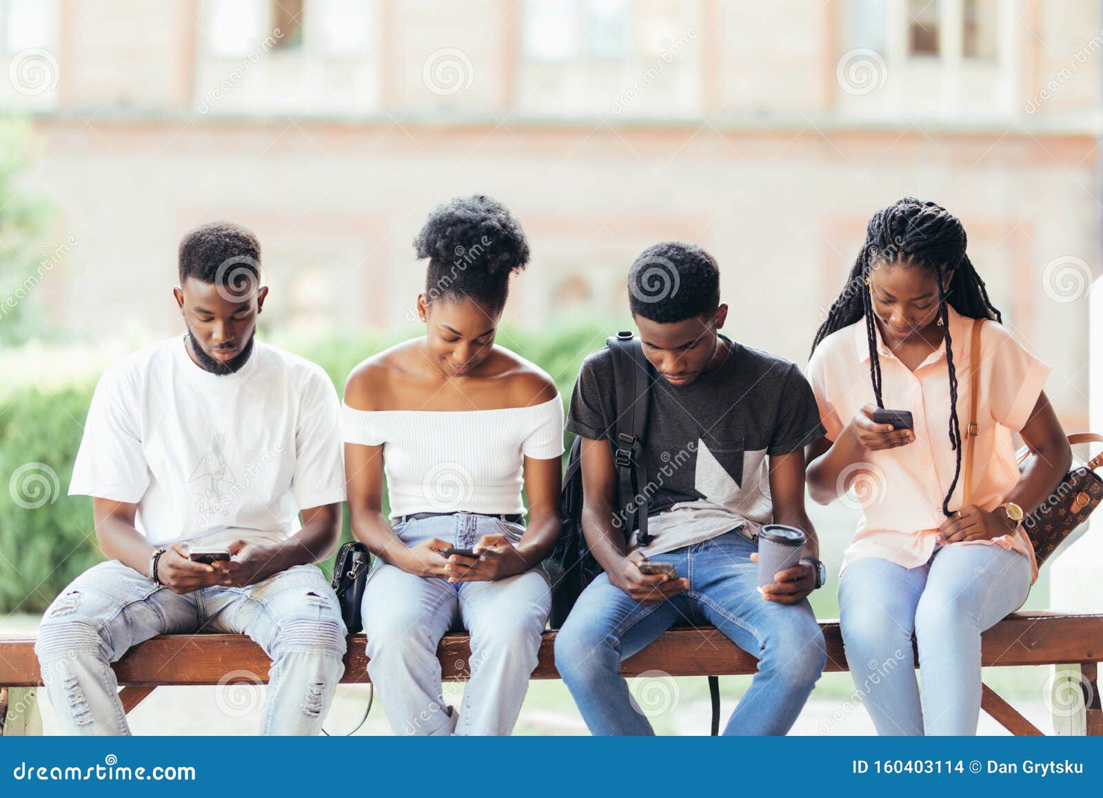 Group of African Students Social Networking Using Several Tech Devices ...