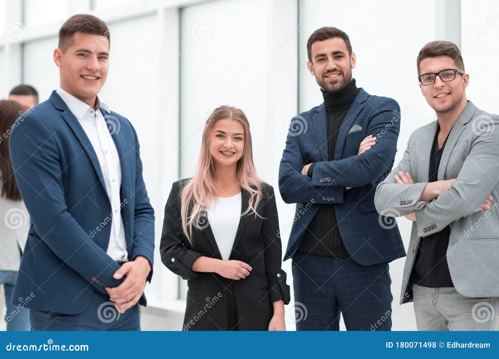 Group of Ambitious Young Employees Standing in the Office. Stock Photo ...