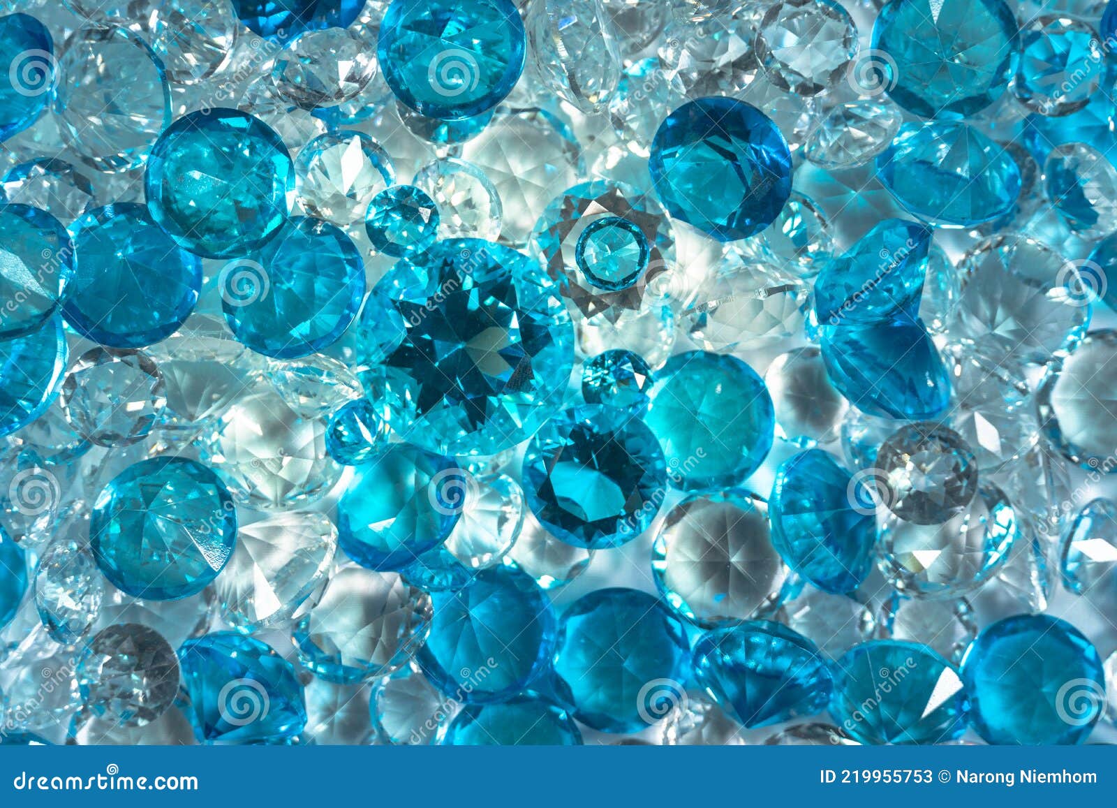 A Group of Aquamarine Blue Diamonds Arranged in the Middle of White ...