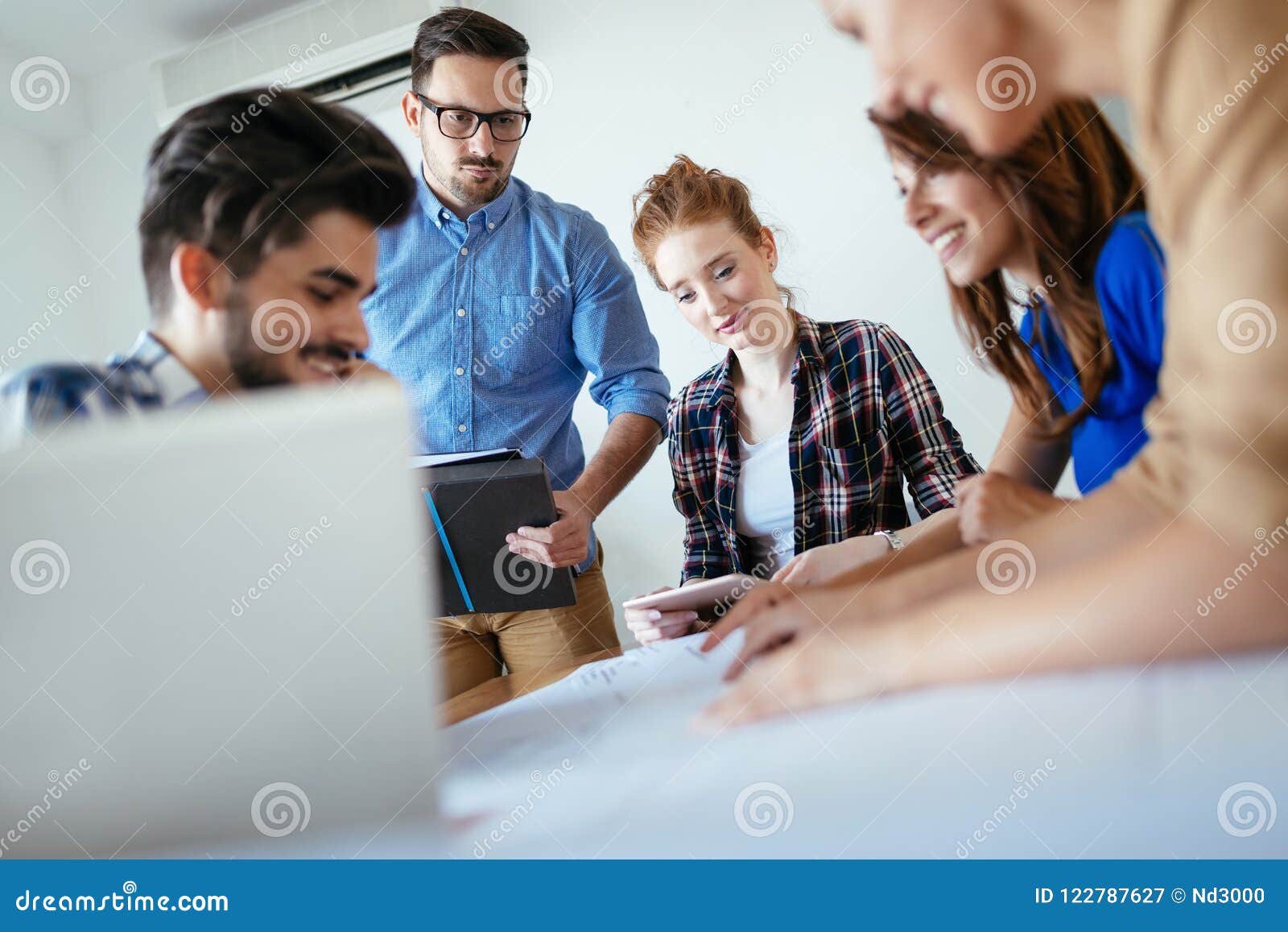 Group of Architects and Designers Working and Collaborating on Project ...