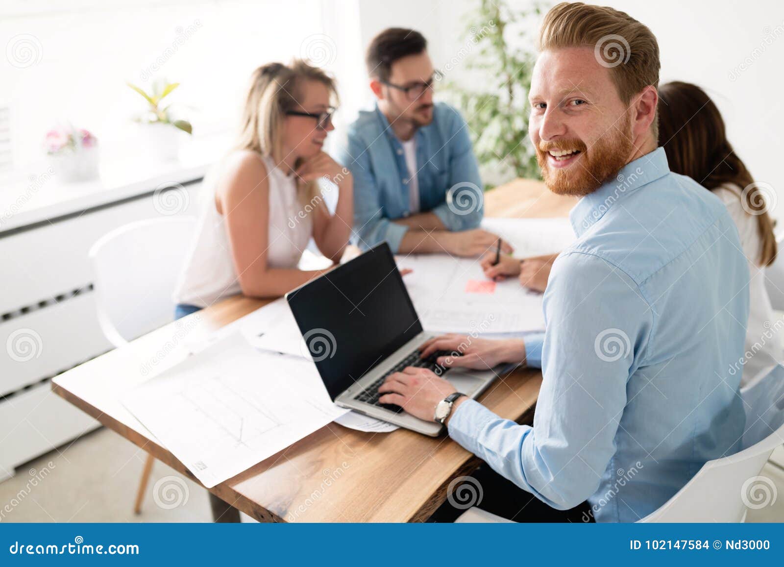 Group of Architects and Designers Working and Collaborating on Project ...