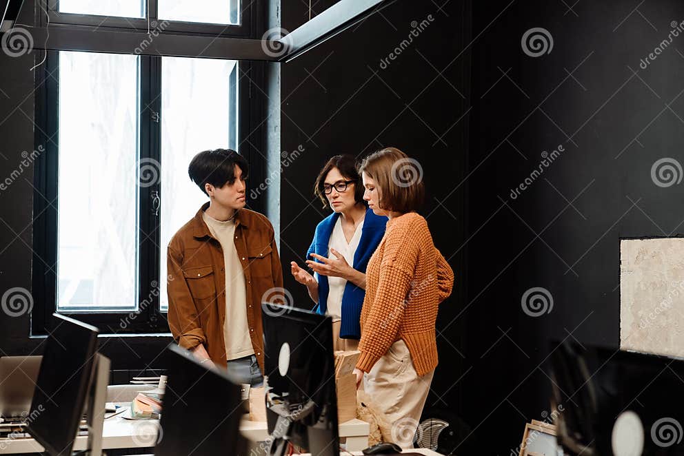 Group of Architects Discussing Design Project in Office Stock Image ...