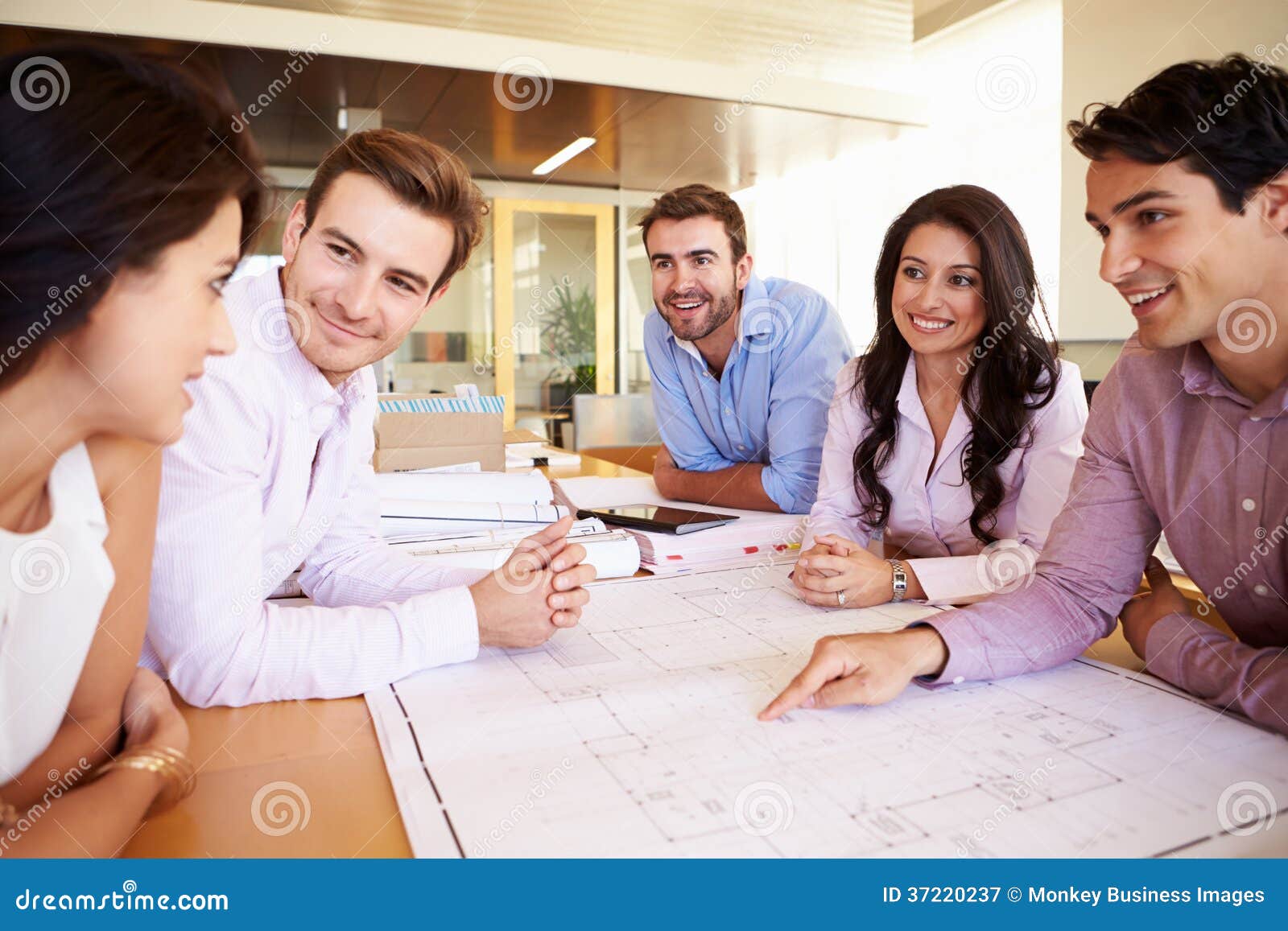 Group of Architects Discussing Plans in Modern Office Stock Image ...