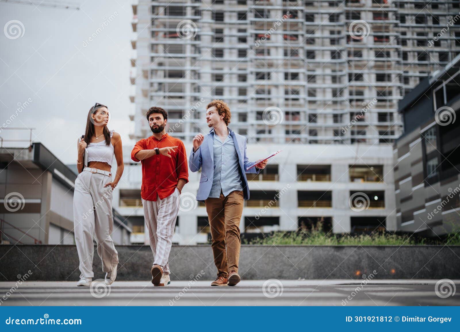 A Group of Architects and Engineers Discussing Project Details and ...