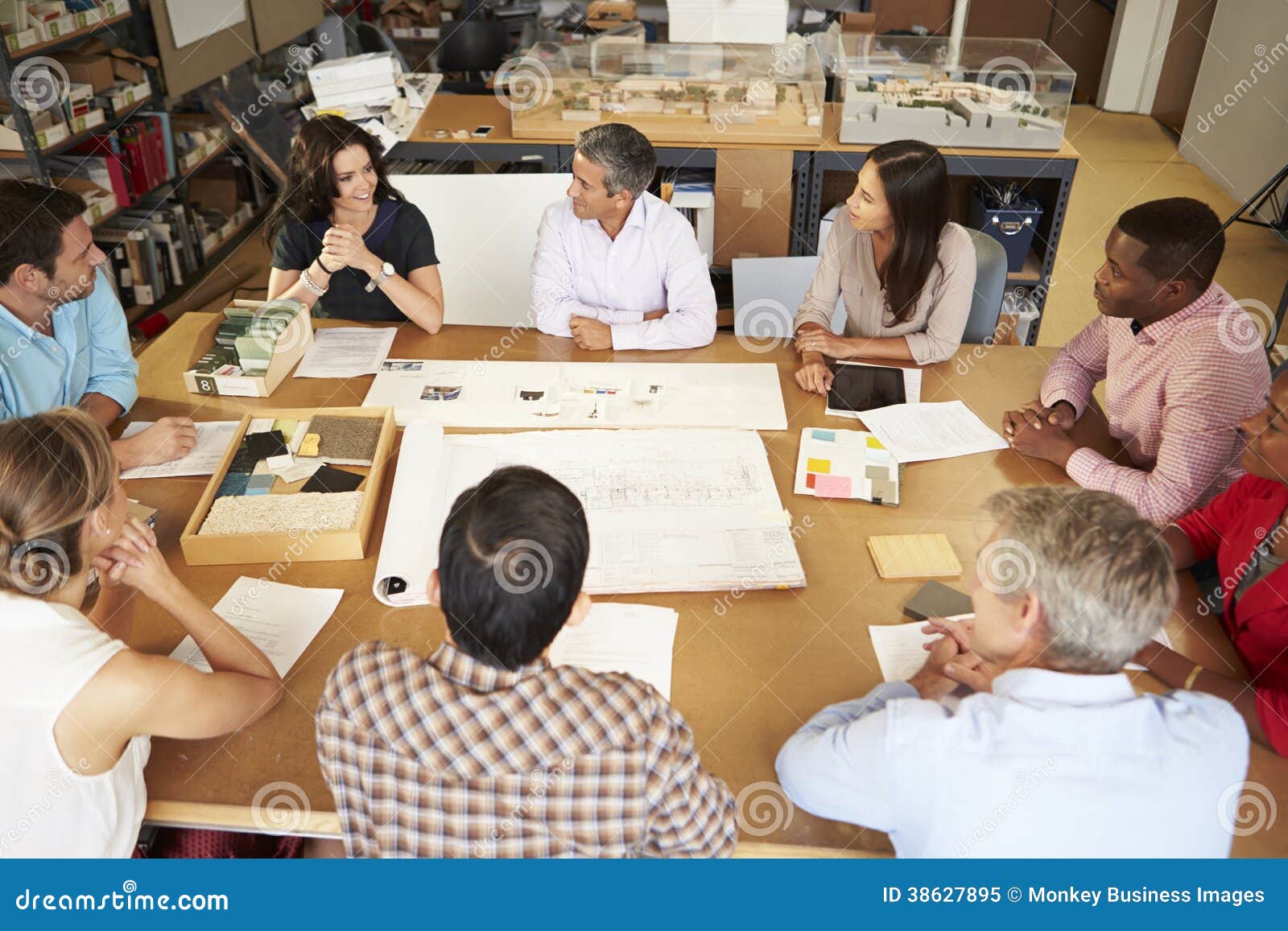 Group of Architects Sitting Around Table Having Meeting Stock Image ...