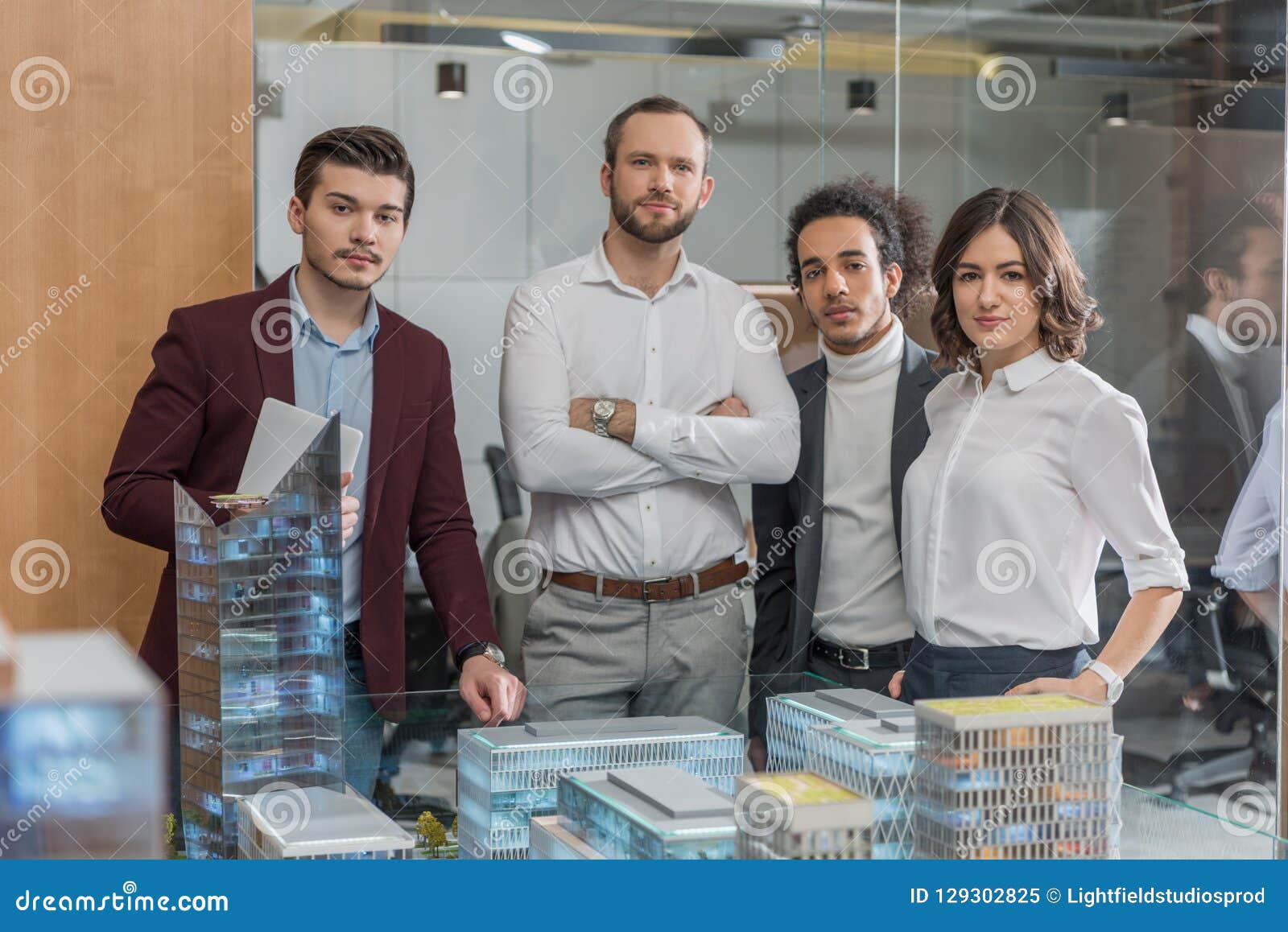 Group of Architects Standing Next To Building Models Stock Image ...
