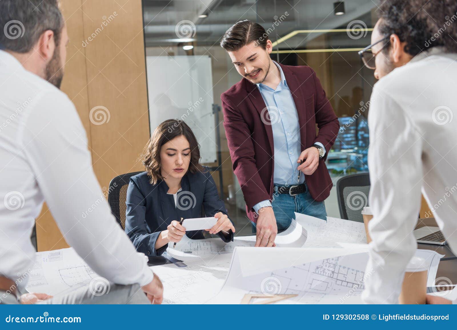 Group of Architects Working Together on Building Plans Stock Photo ...