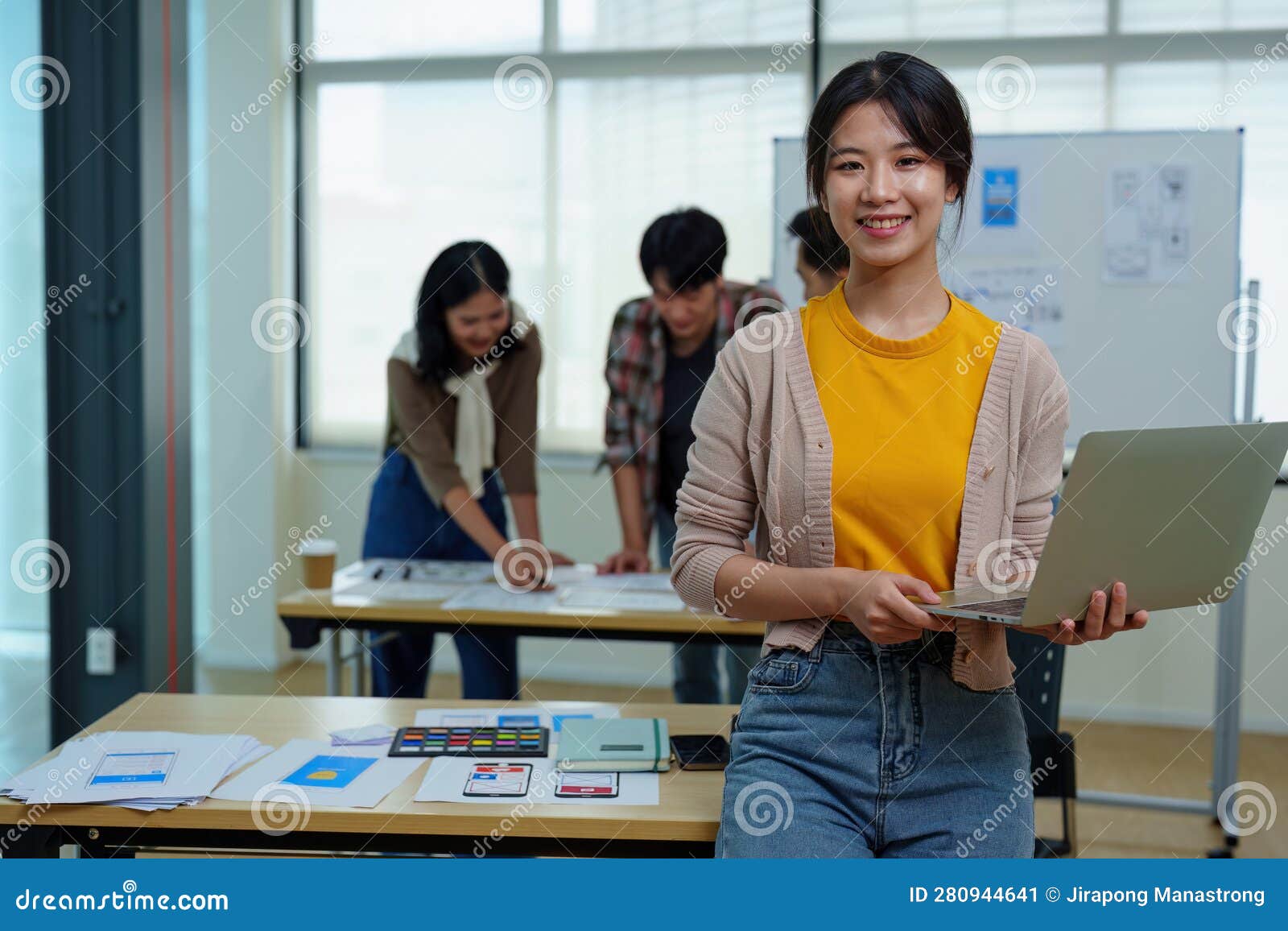 Group of Asian Creative Team Programing Designers Participate in All Phases of the UX UI Design ...