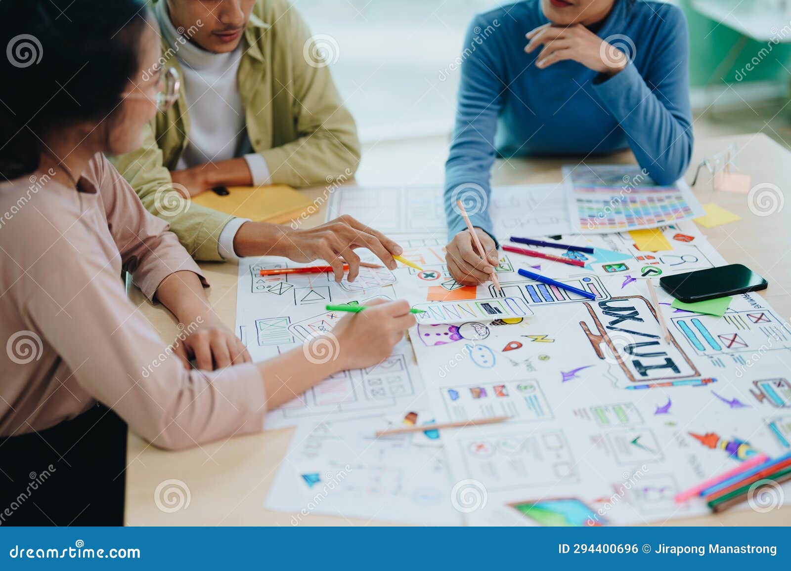 Group of Asian Creative Team Programing Designers Participate in All Phases of the UX UI Design ...