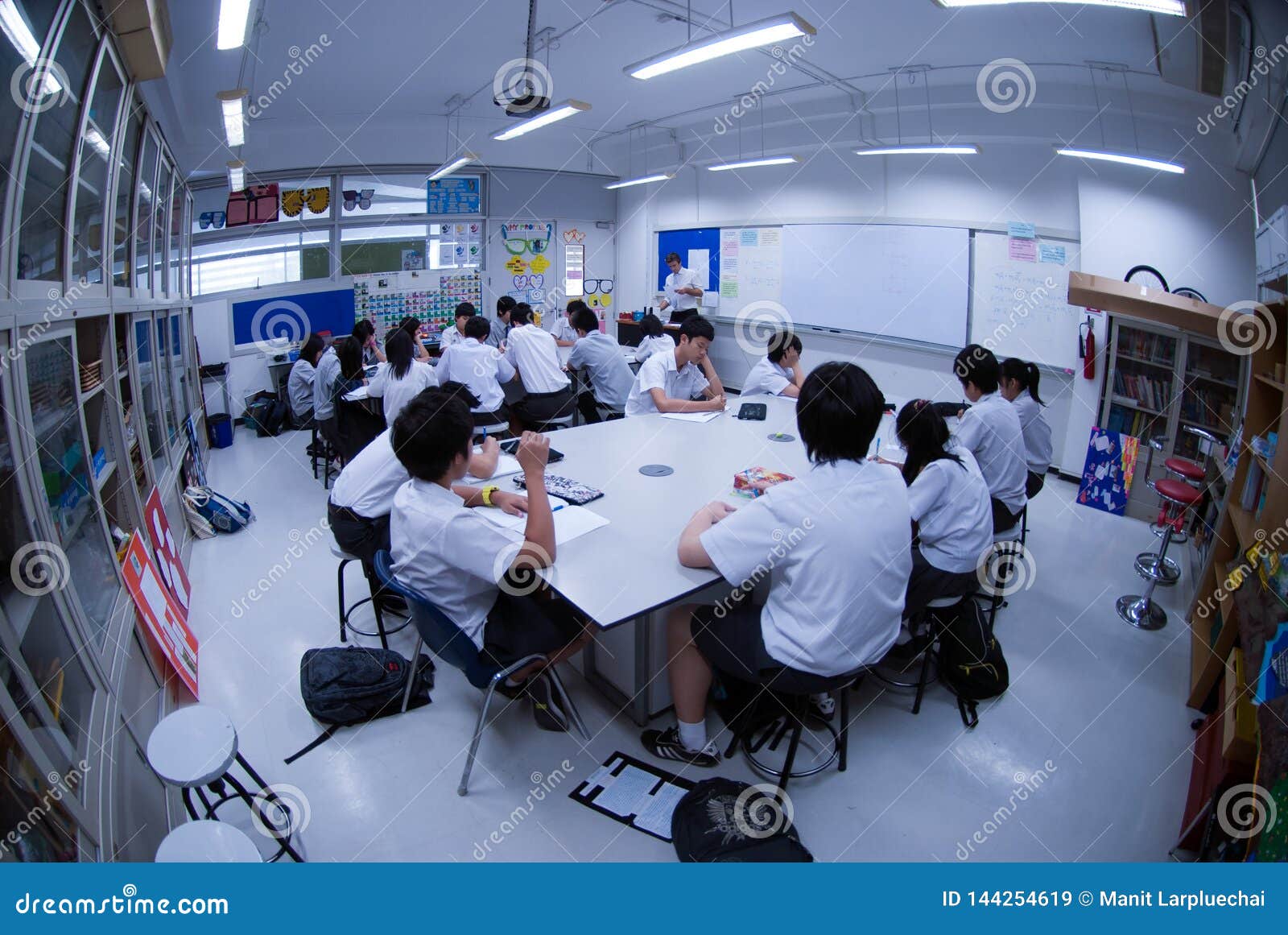 Group of Asian Elementary Students are Learning about Electricity in ...