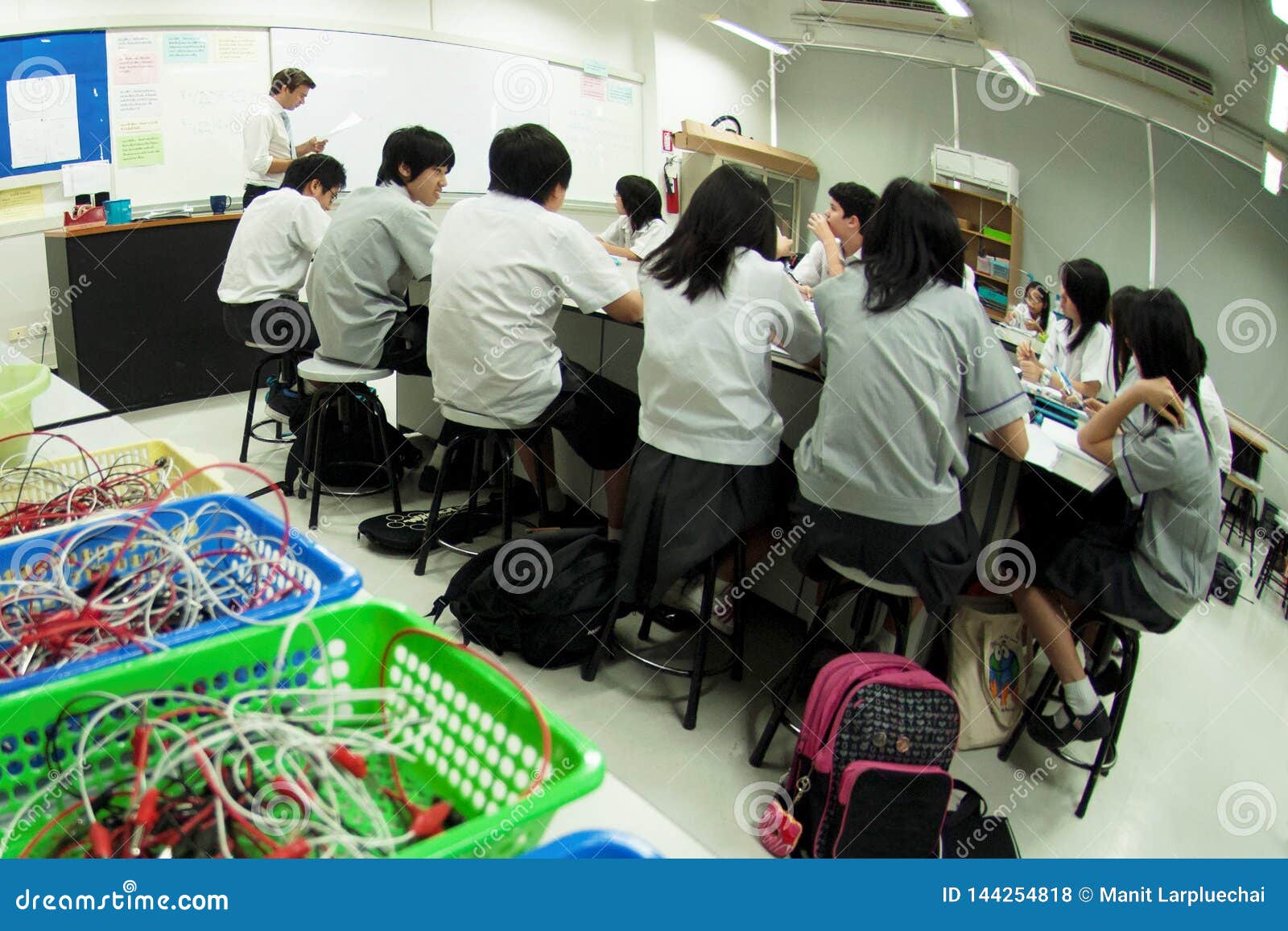 Group of Asian Elementary Students are Learning about Electricity in ...