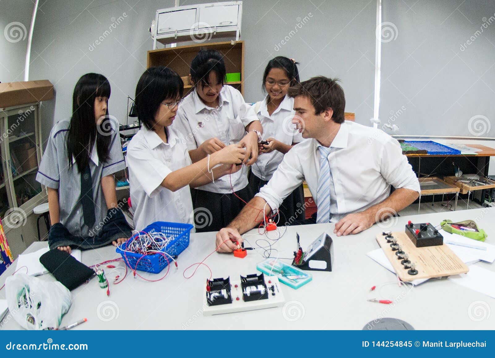 Group of Asian Elementary Students are Learning about Electricity in ...