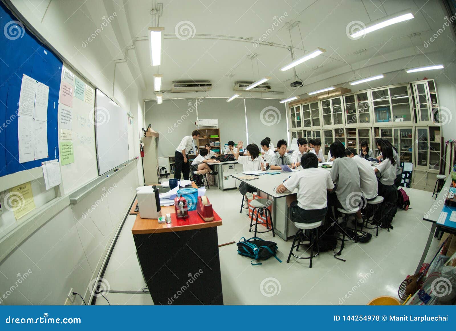 Group of Asian Elementary Students are Learning about Electricity in ...