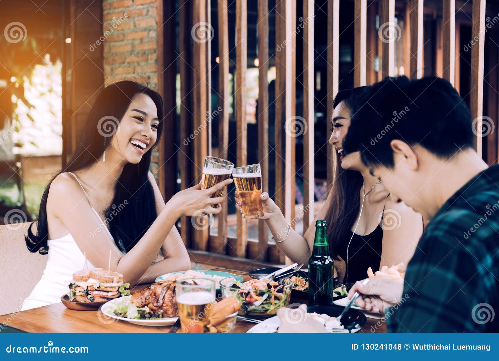 Group of Asian People Cheering Beer at Restaurant Happy Hour in Stock ...