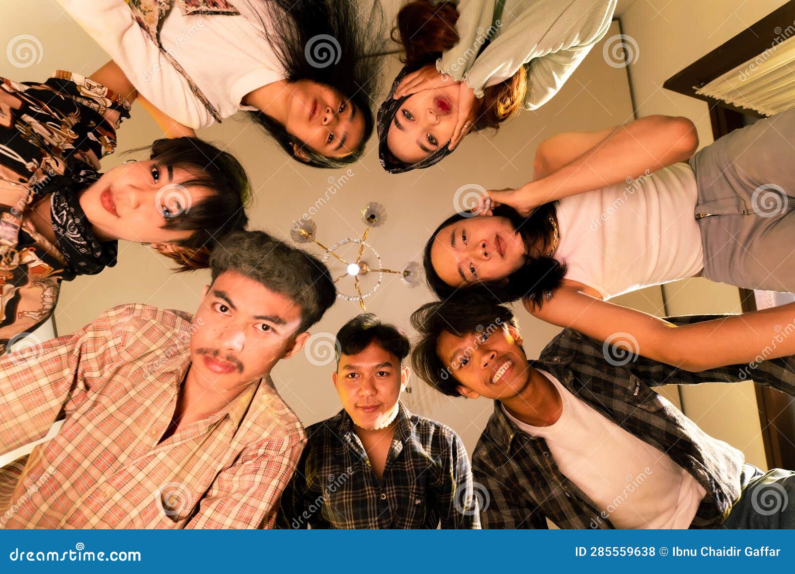 A Group of Asian People are Looking Down Simultaneously with Serious Faces Stock Photo - Image ...