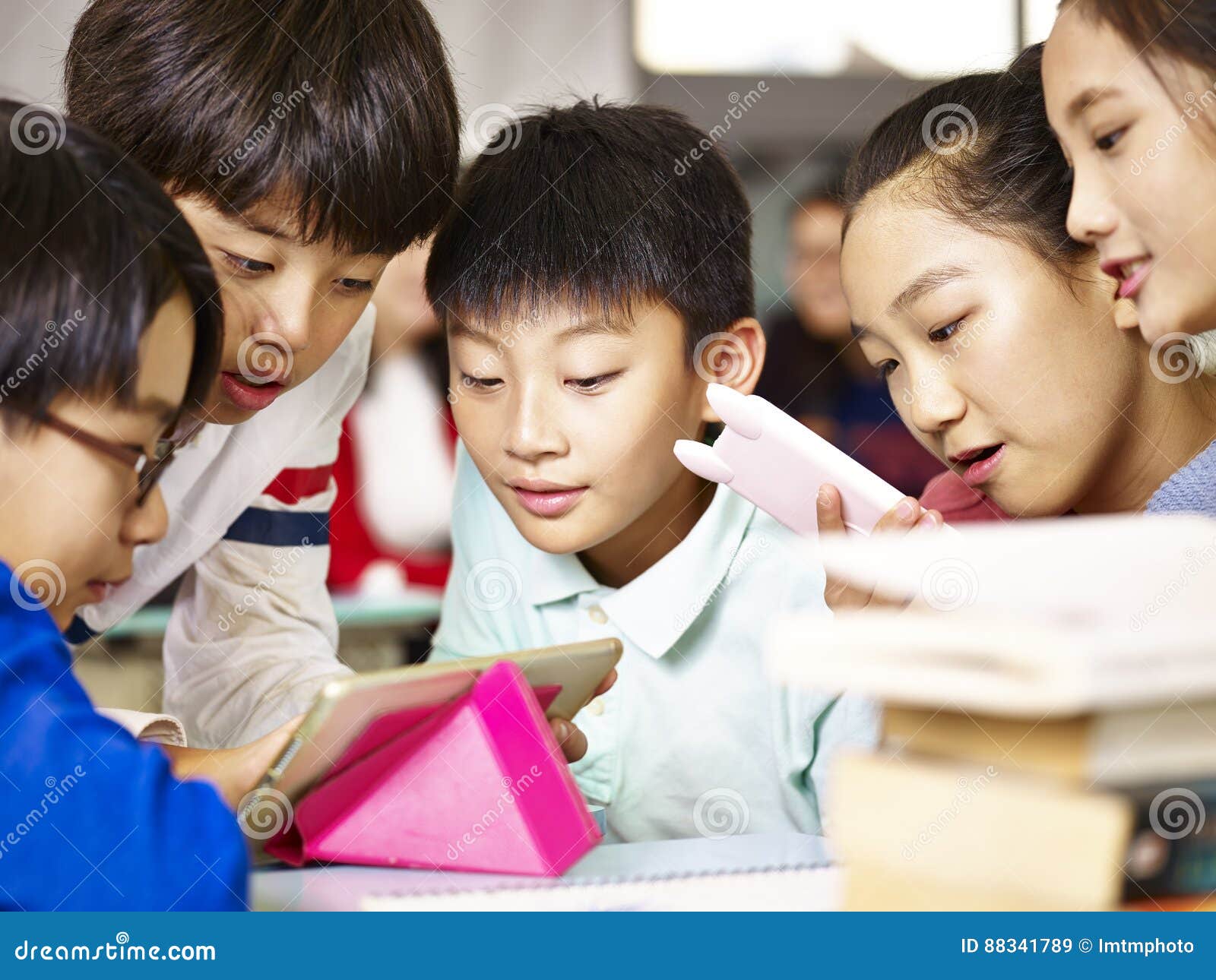 Group of Asian Primary School Pupil Playing Game Using Tablet Stock ...