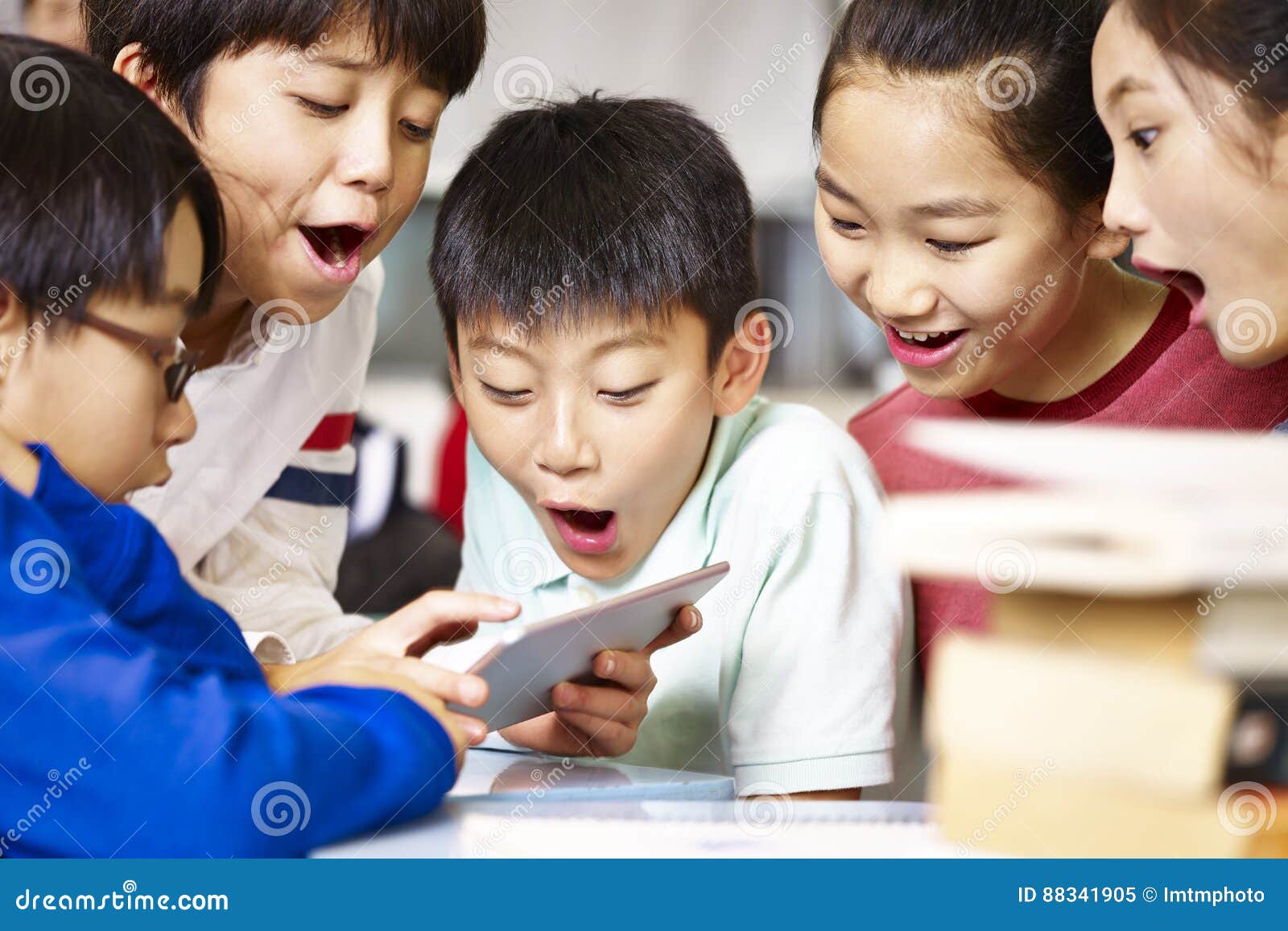 Group of Asian Primary School Pupil Playing Game Using Tablet Stock ...
