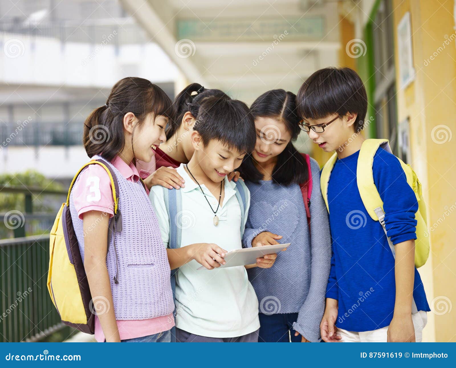 Group of Asian Pupils Using Tablet Computer at School Stock Image ...