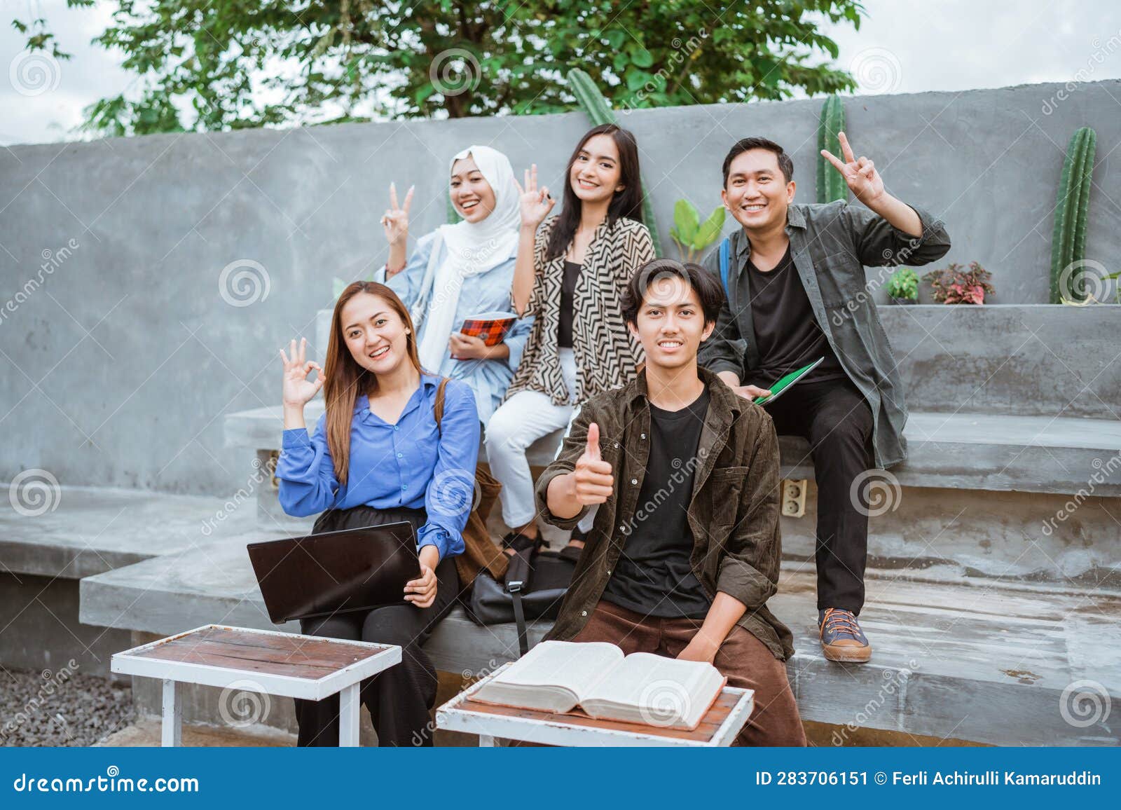 A Group of Asian Students Smile at the Camera Outside the Campus Stock ...