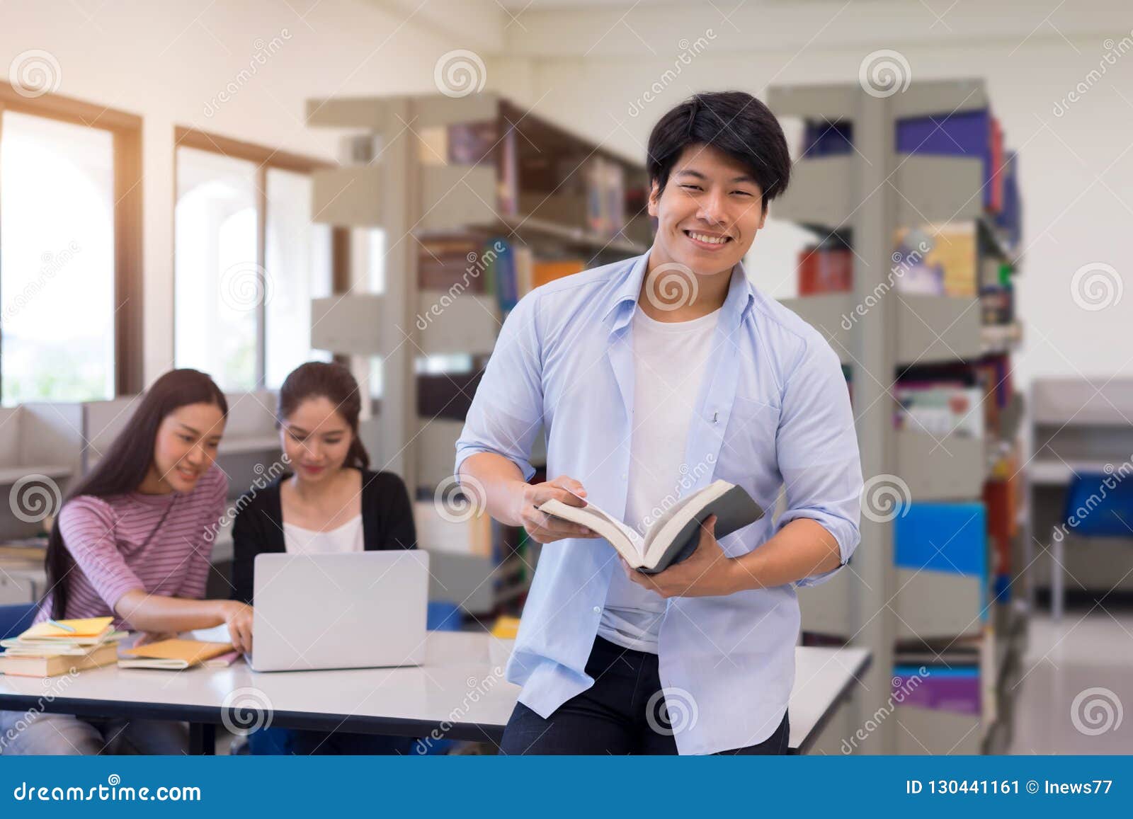 Group of Asian Students Studying Together in Library, Learning a Stock ...