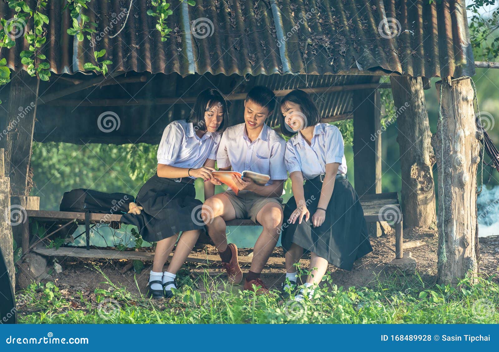 Group of Asian Students in Uniform Studying Together Stock Photo ...