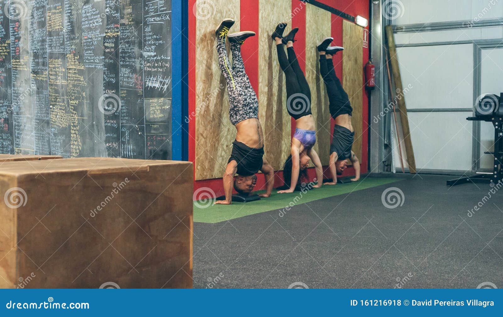 Athletes Doing Headstands in the Gym Stock Photo - Image of blackboard ...