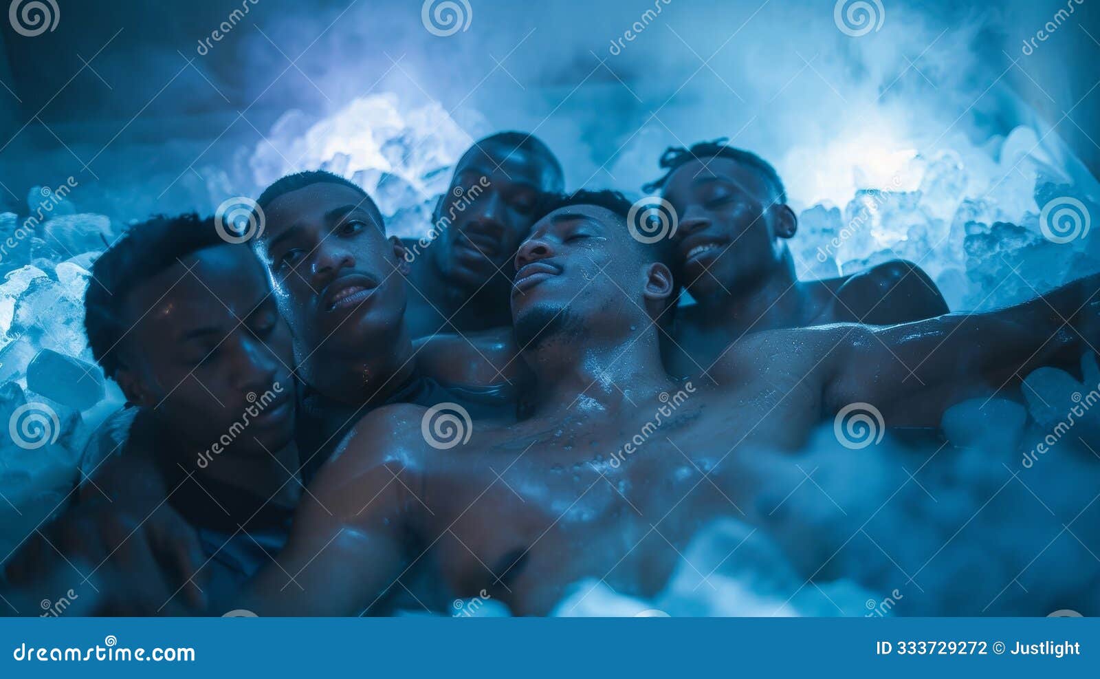 A Group of Athletes Huddled Together in an Ice Bath Using Cryotherapy ...