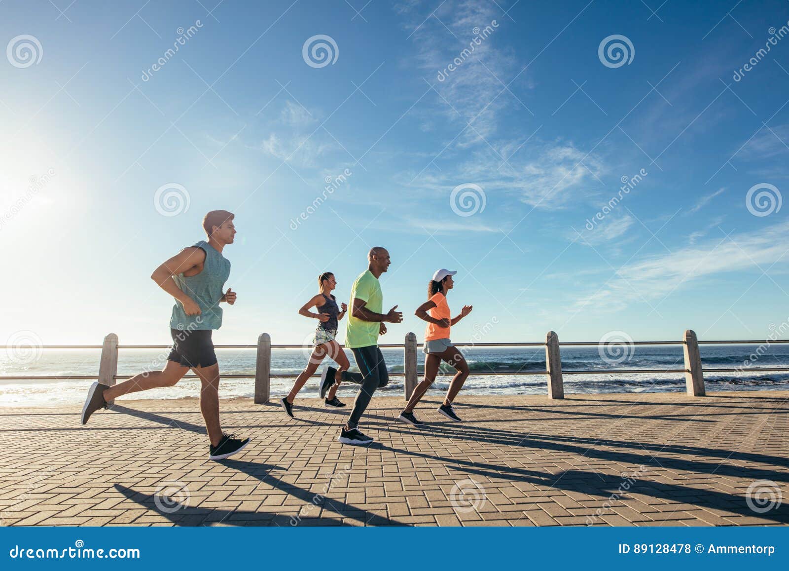 Group of Athletes Running on Ocean Front Stock Photo - Image of running ...