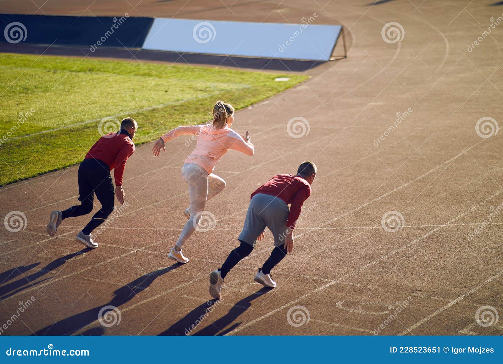 Group of Athletic Sprinters at Starting Position Ready for Race on ...