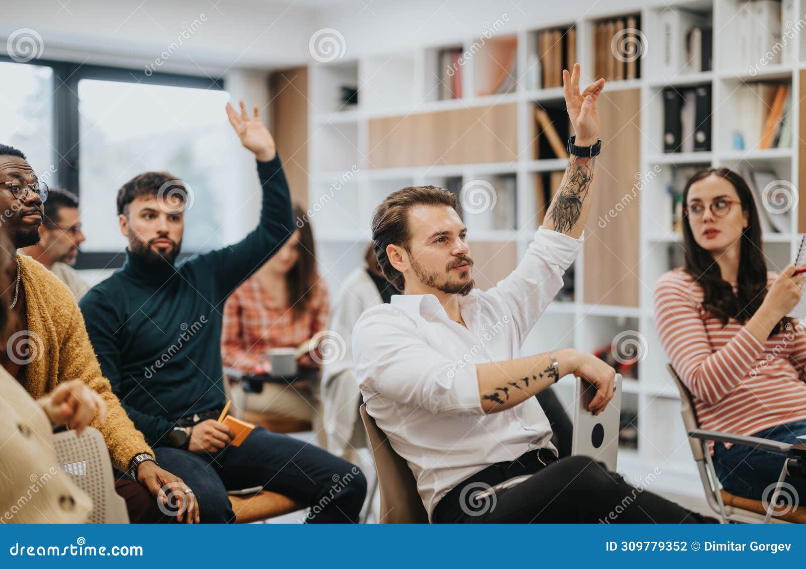 Group of Attentive Diverse Adults in a Workshop Setting, Actively ...