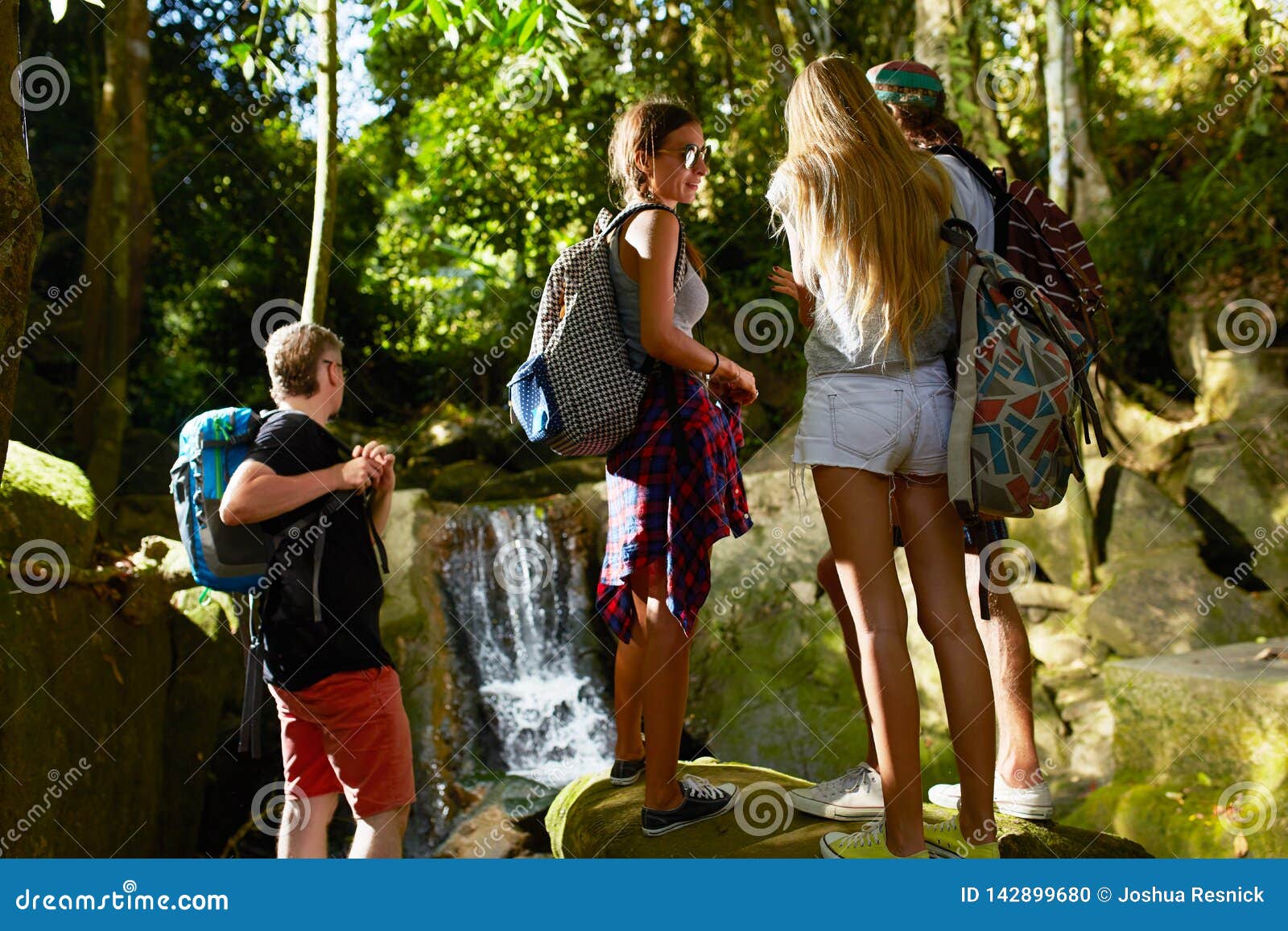 Group of Backpackers in Thailand Looking at Jungle Waterfall Stock ...