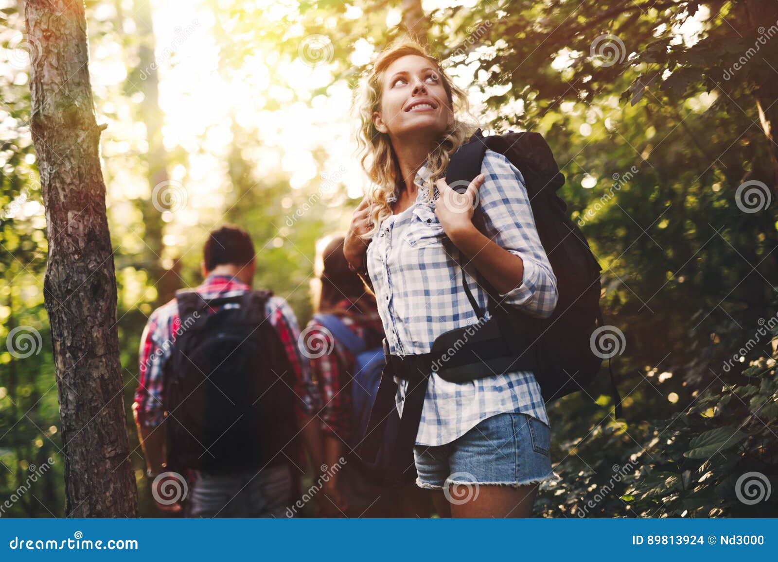 Group of Backpacking Hikers Going for Forest Trekking Stock Photo ...