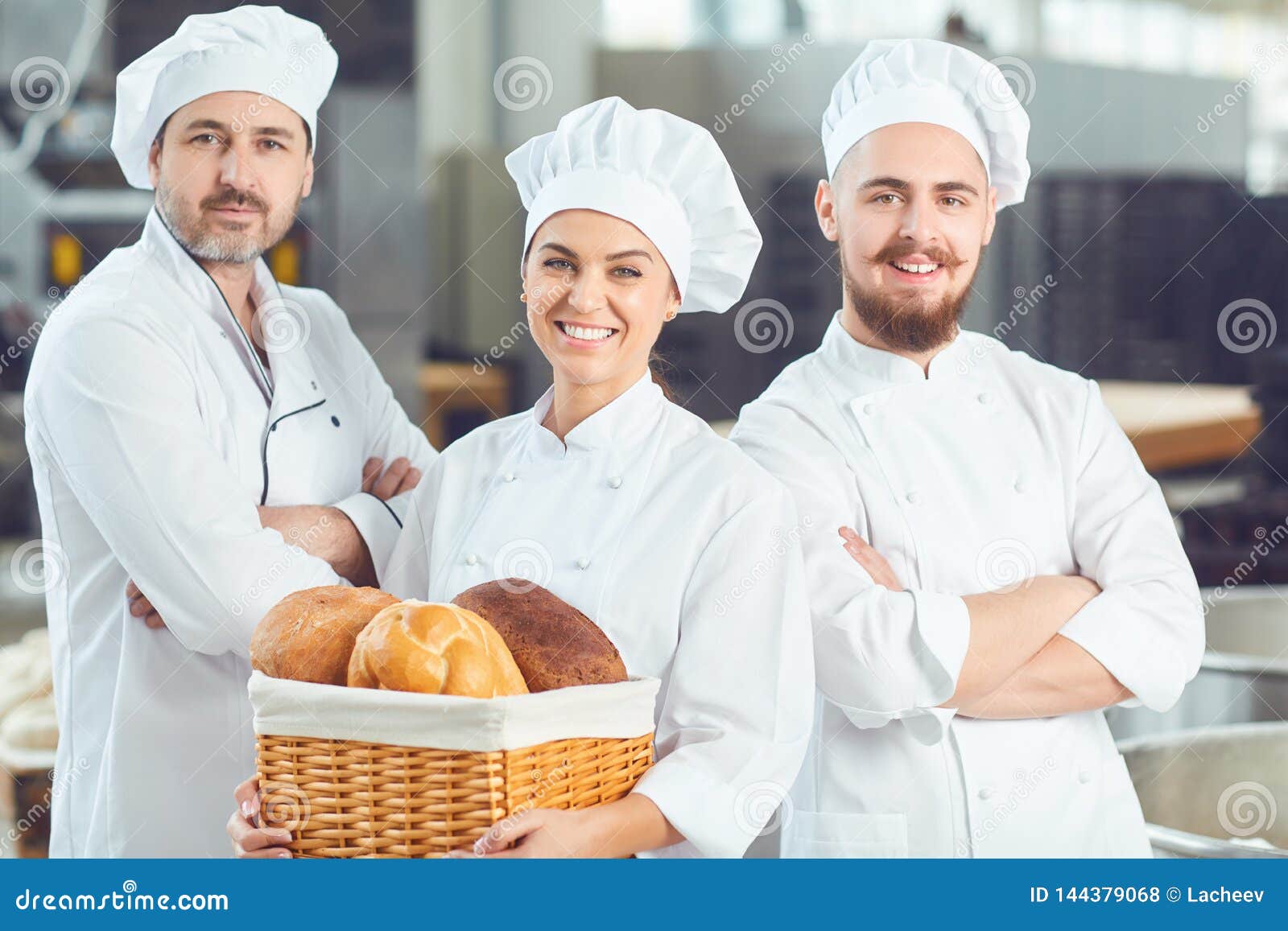 A Group of Bakers Smiles at the Bakery Stock Photo - Image of staff ...