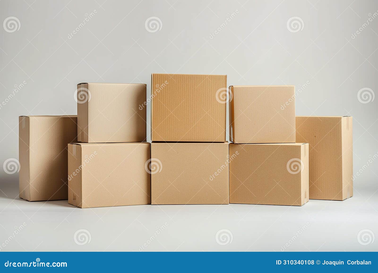 A Group of Blank Cardboard Boxes Stacked Tall in a Cascading Formation ...