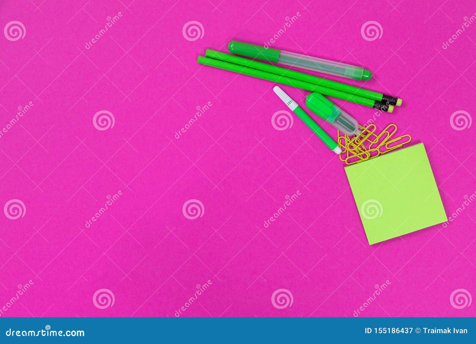 A Group of Bright Green Office Requisites is Lying in the Upper Right ...