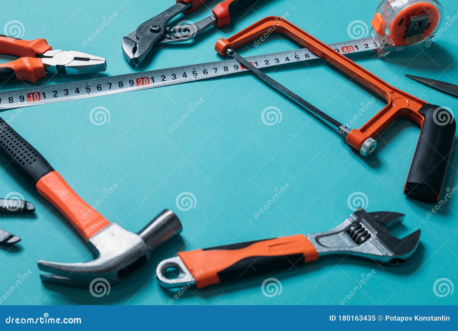 Group Bunch of Tools with Orange Handles on a Blue Background Close ...