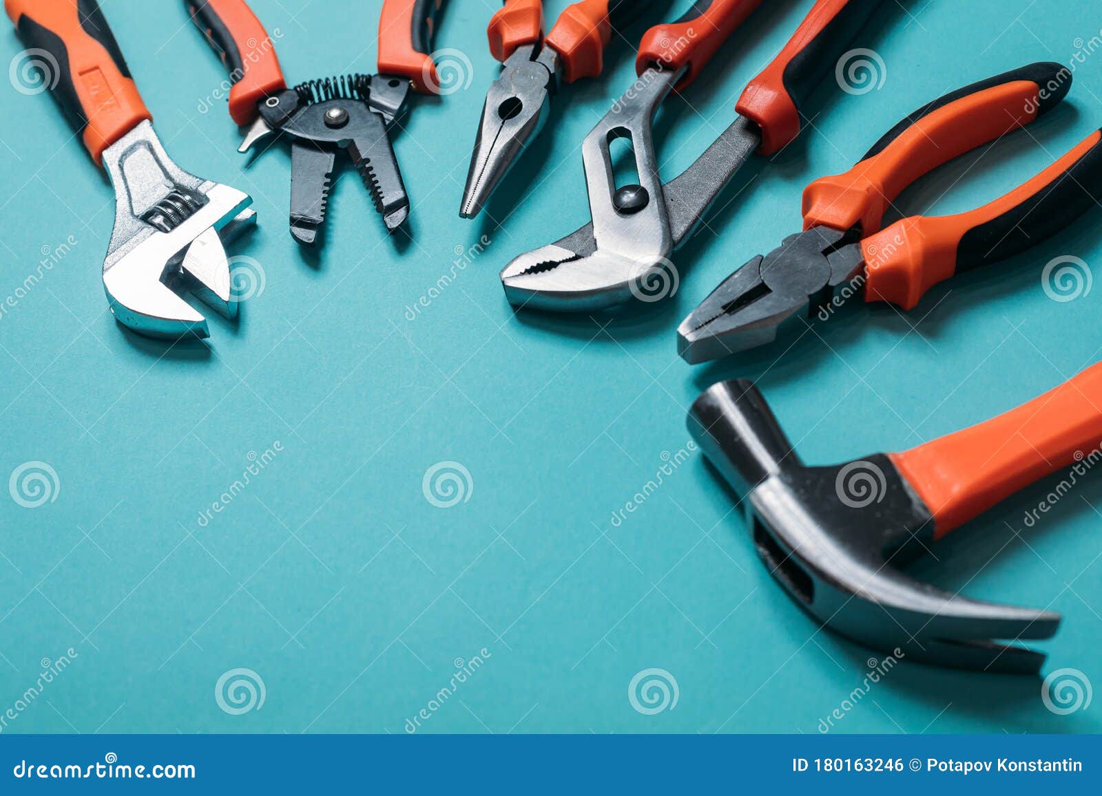 Group Bunch of Tools with Orange Handles on a Blue Background Close ...